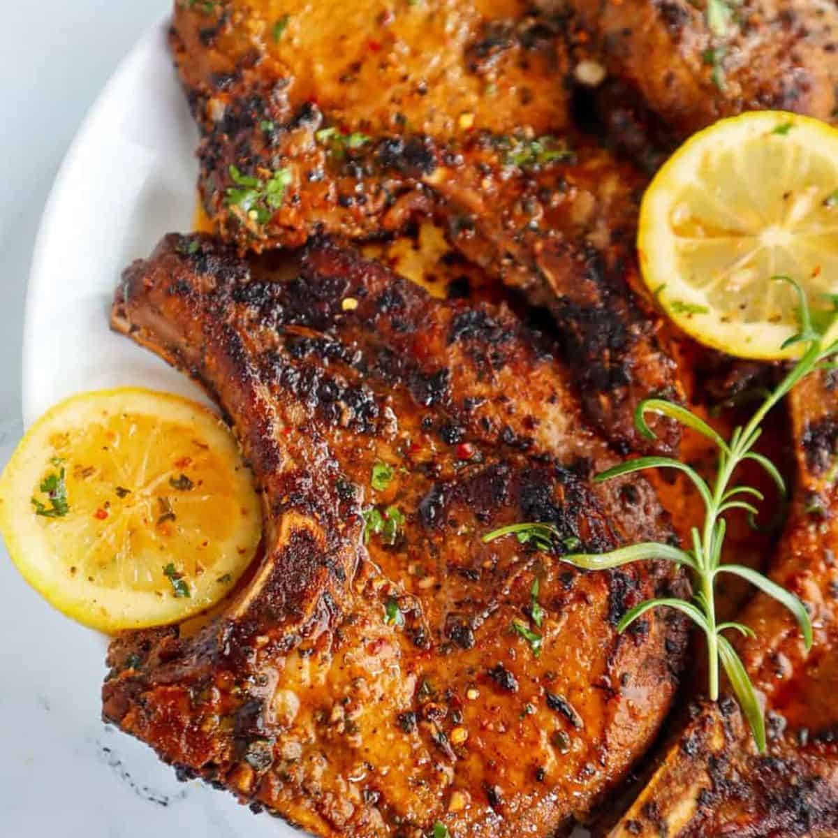 Baked Herbed Pork Chops with Garlic Butter - Cooking With Claudy